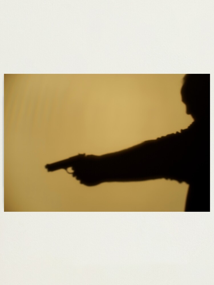 "Shadow of man pointing gun, side view, close-up" Photographic Print by ...