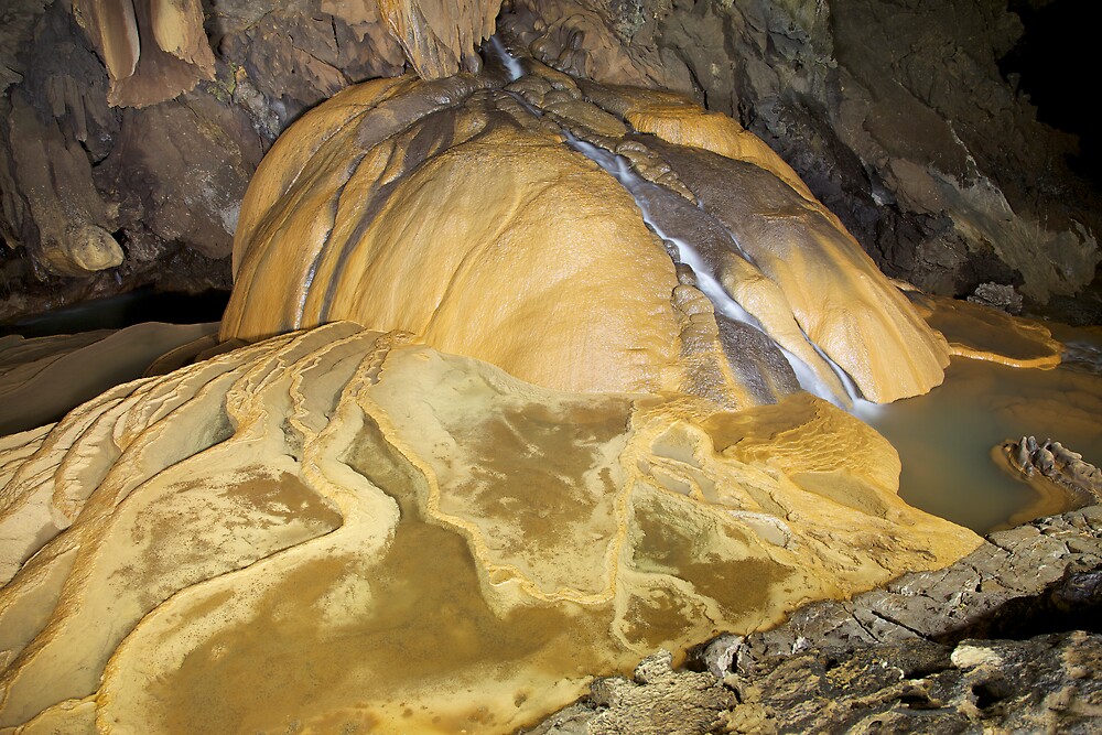 "Flowstone waterfall in Thai cave" by John Spies | Redbubble