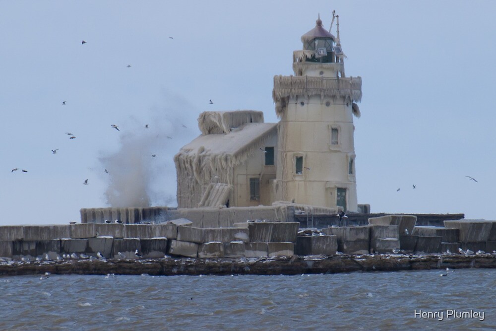 "Tight shot of the Cleveland lighthouse in a coating of ice" by Henry ...