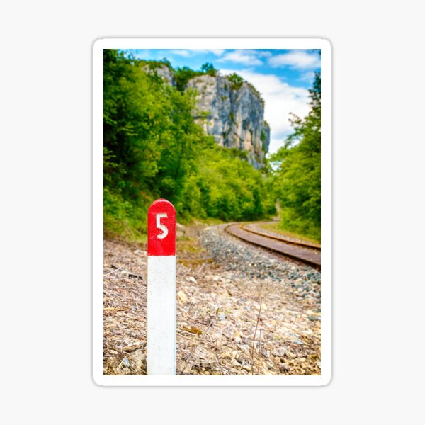 "Railway pole sign close-up with number five along railroad track ...