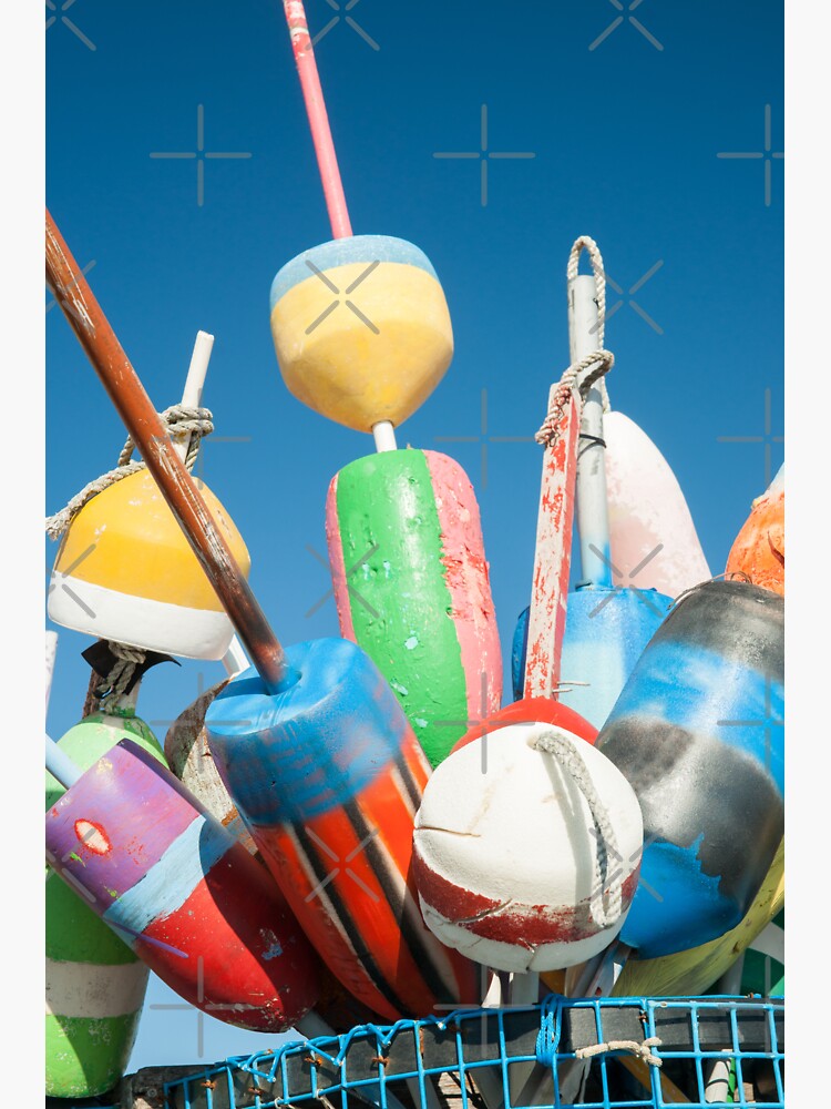 "Collection of colorful fishing or lobster trap buoys and markers at ...