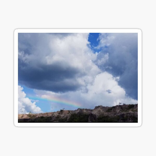 "Blue sky with rainbow over cliff" Sticker for Sale by Sweetnella2011 ...