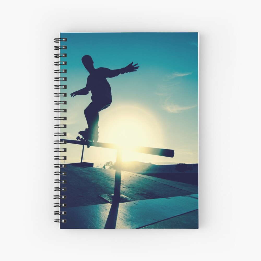 "Skateboarder silhouette on a grind" Spiral Notebook by homydesign ...