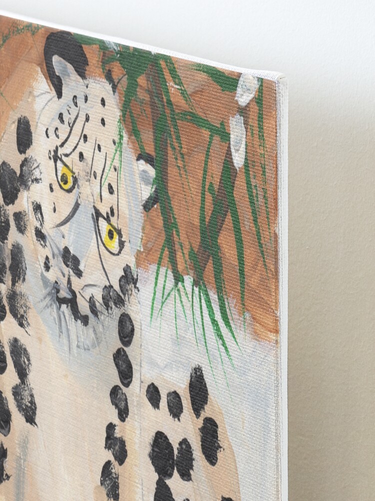 "Snow leopard sniffing the pine tree" Mounted Print for Sale by ...