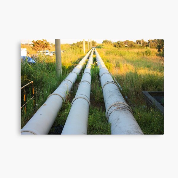 "three long parallel large diameter steel pipes of outdoor pipeline in ...