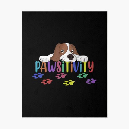 "Pawsitivity The cute little puppy is lying on the colorful word ...