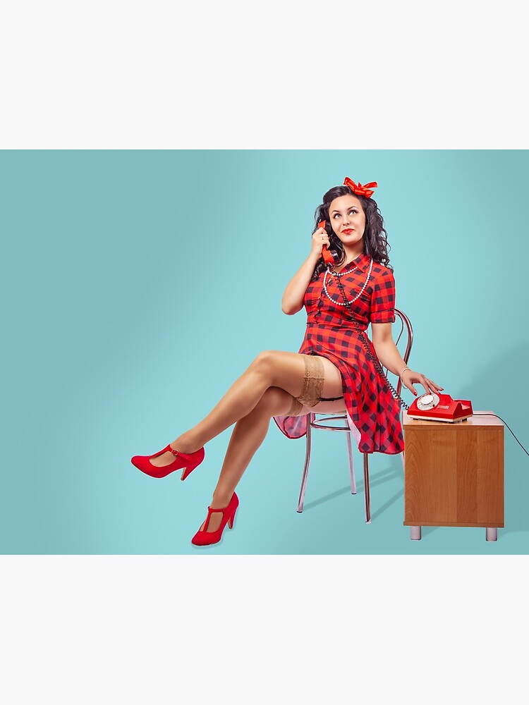 "young pinup woman sitting on chair and talking on phone" Poster by ...
