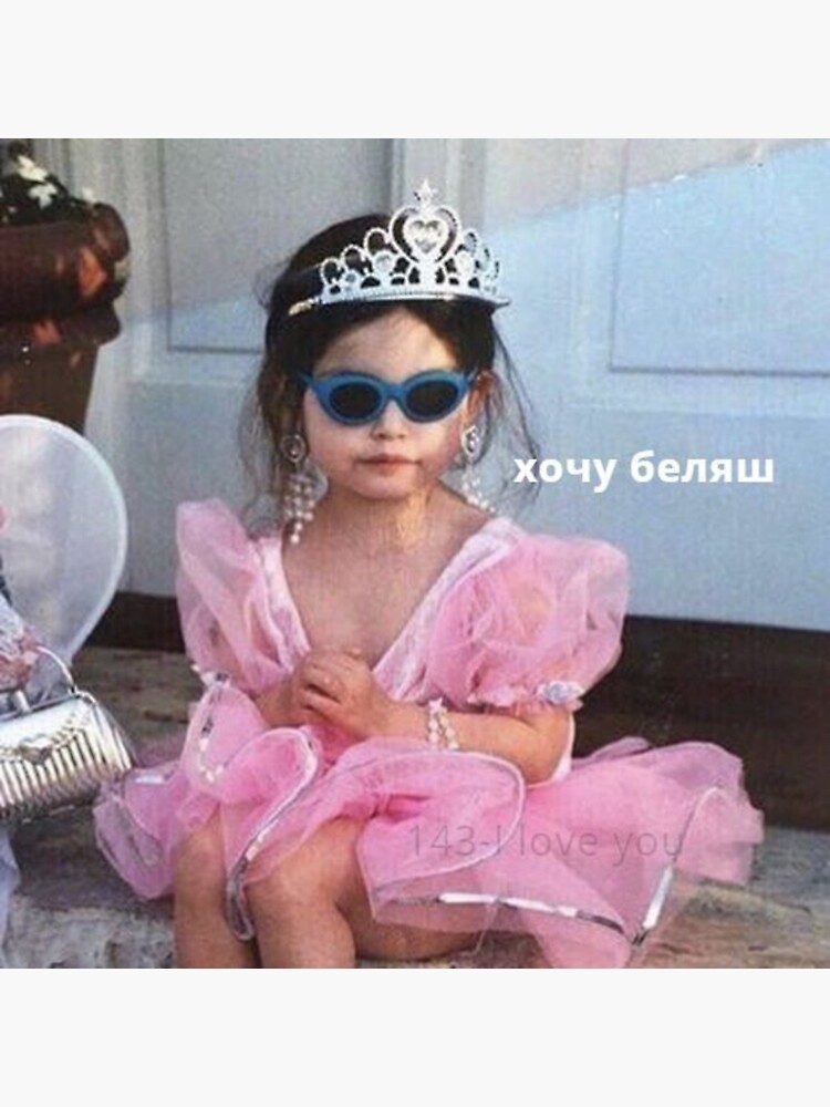 "A young cool girl in glasses (and crown) sits like a queen/princess ...