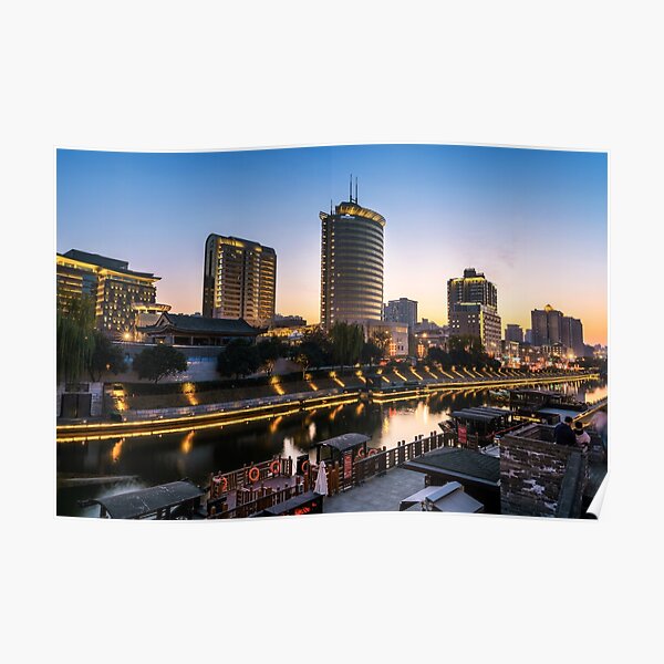 "Evening view of city buildings along the riverside in Xian" Poster for ...