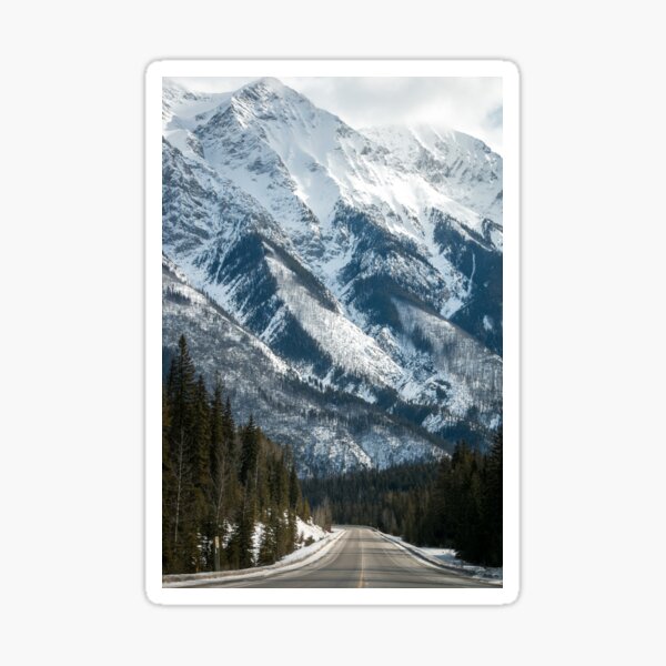"Road In The Forest With Snow Mountain" Sticker for Sale by PosterOcean ...