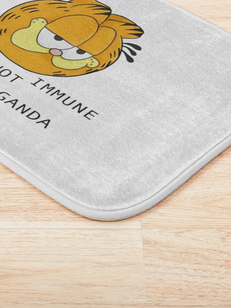 You are not immune to propaganda - garfield Bath Mat sold by Zhen L ...