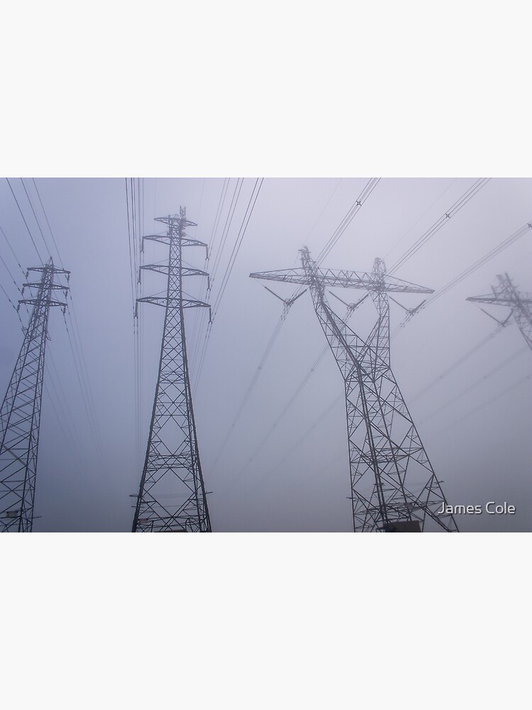 "Towering electrical power pylons disappearing into thick fog landscape ...