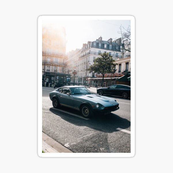 "Blue vintage car parked on city street" Sticker by autoisthemotive ...