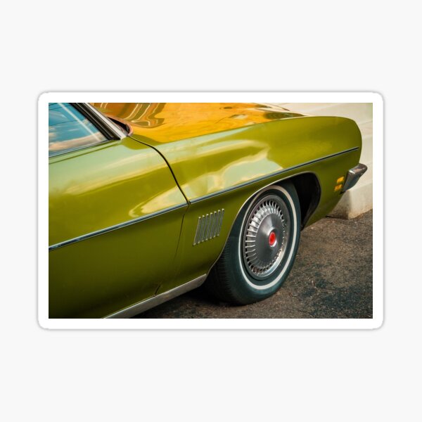 "The front side of a classic olive green car" Sticker by ...