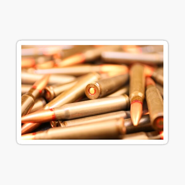 "A close up image of metallic bullets" Sticker for Sale by ...