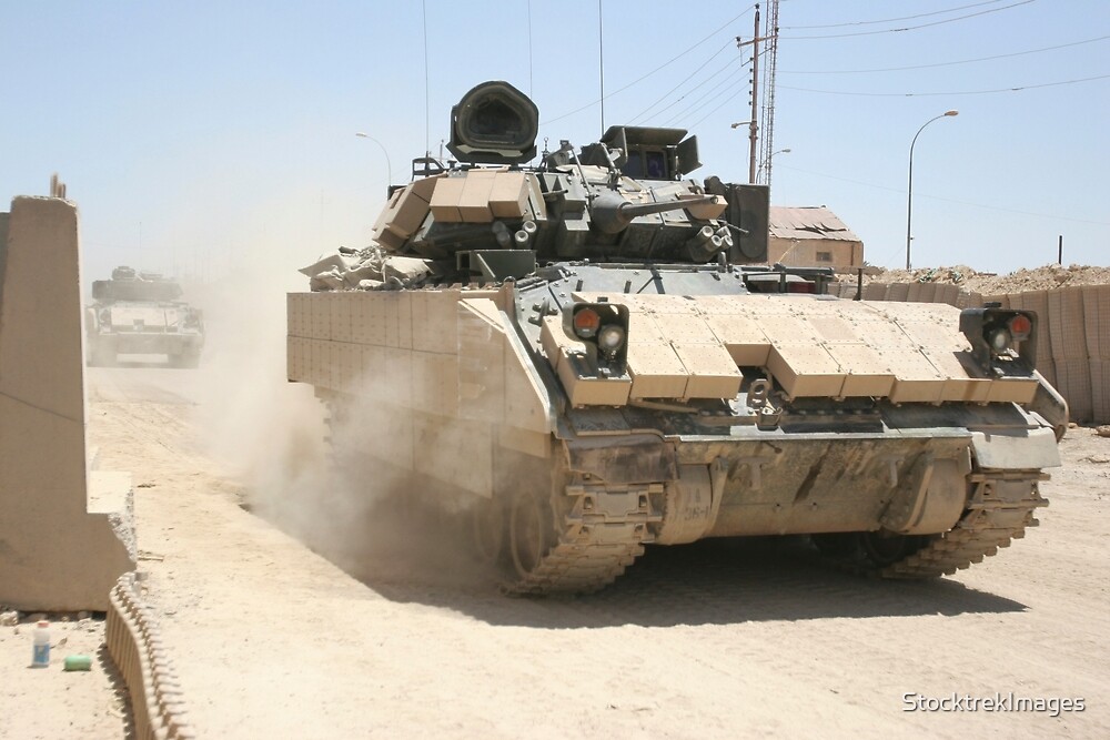 "An M2 Bradley Fighting Vehicle patrols past Command Post Hit, Iraq ...