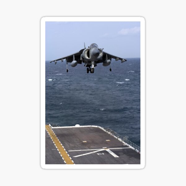"An AV-8B Harrier II prepares to land on the flight deck of USS Nassau ...