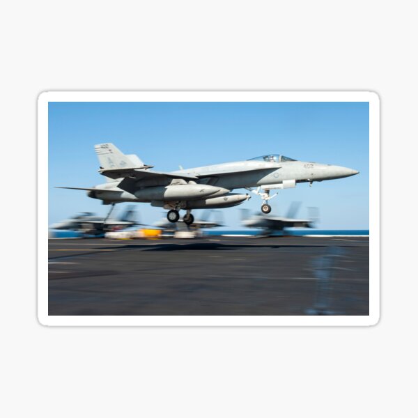 "An F/A-18E Super Hornet lands on the flight deck of USS Harry S ...