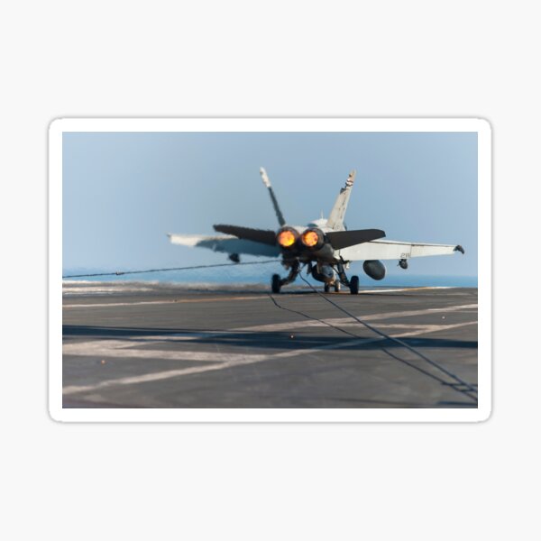 "An F/A-18C Hornet lands on the flight deck of USS Harry S. Truman ...