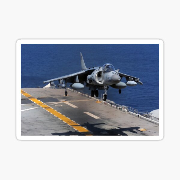 "An AV-8B Harrier jet lands on the flight deck of USS Essex." Sticker ...