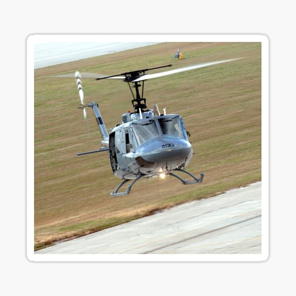 "Captain pilots the TH-1H trainer helicopter with instructor pilot ...
