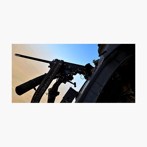 "Soldier mans the .50 caliber machine gun on a HH-60G Pave Hawk ...