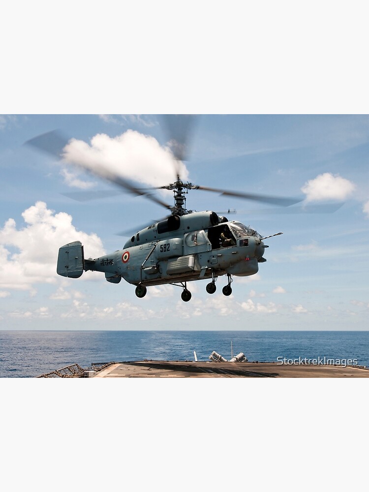 "An Indian Navy Kamov Ka-31 lands on the flight deck of USS Bunker Hill ...