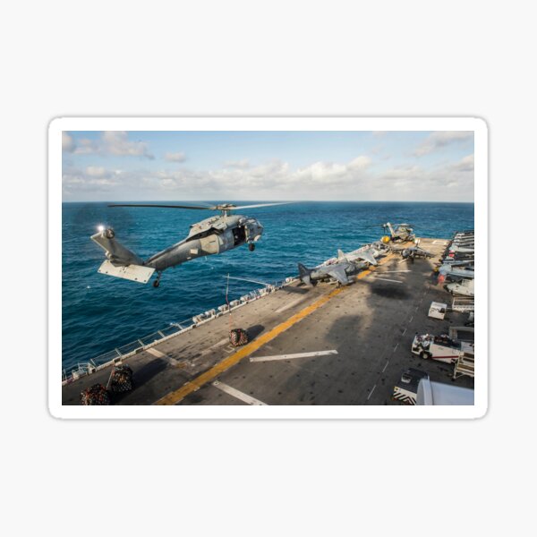 "An MH-60S Sea Hawk helicopter delivers supplies to USS Bonhomme ...