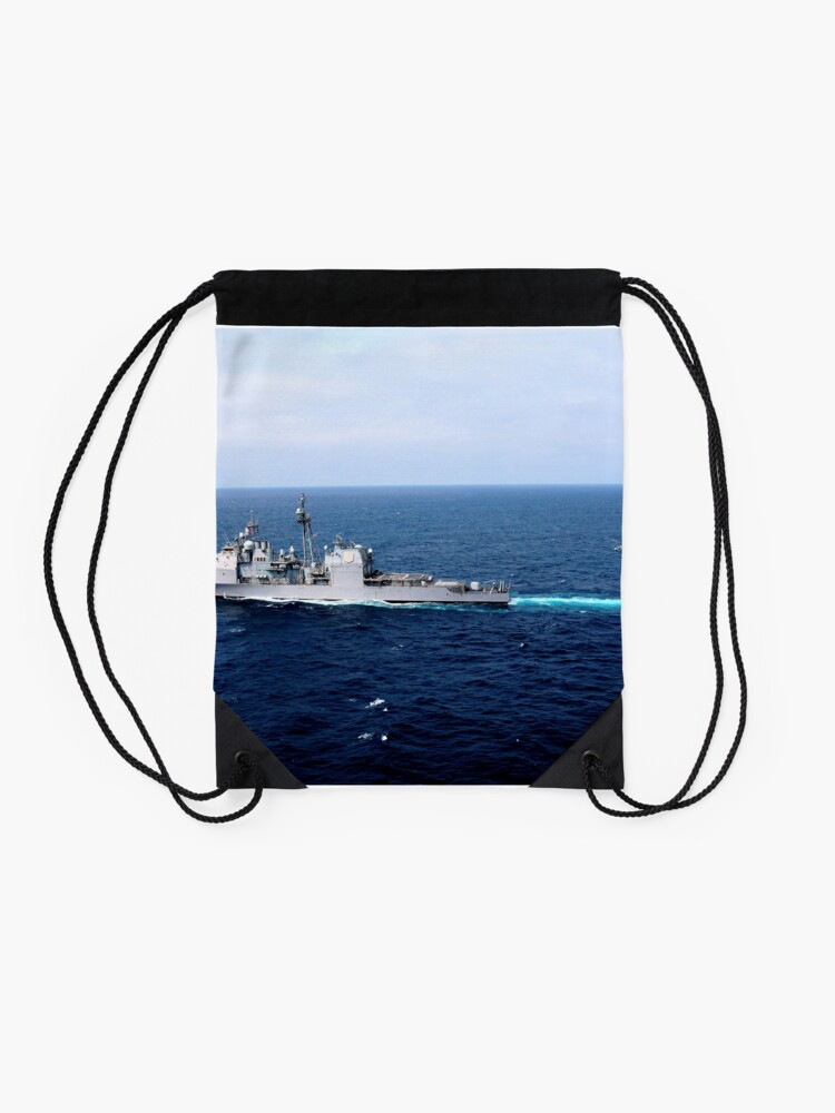 "An HH-60H Sea Hawk helicopter perpares to land aboard the guided ...