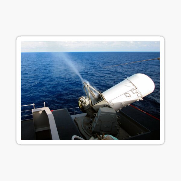 "Smoke rolls down the barrels of the forward-starboard-mounted MK 15 ...