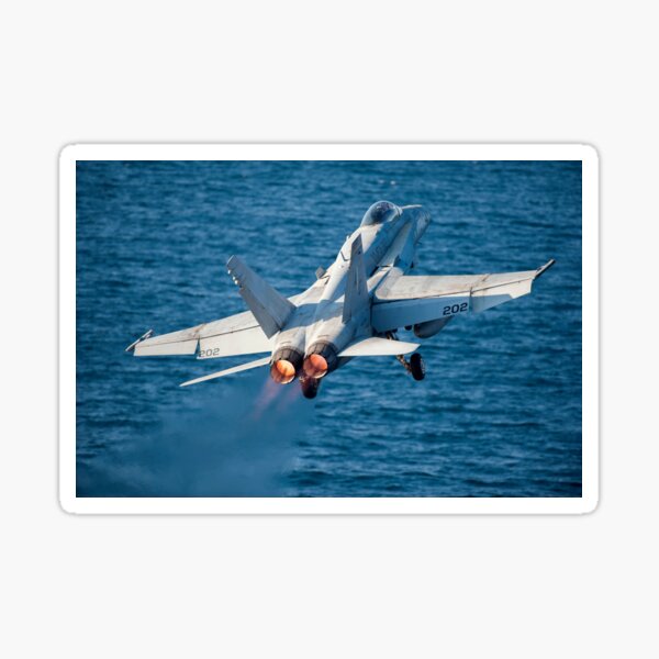 "An F/A-18C Hornet launches from the flight deck of USS Harry S. Truman ...