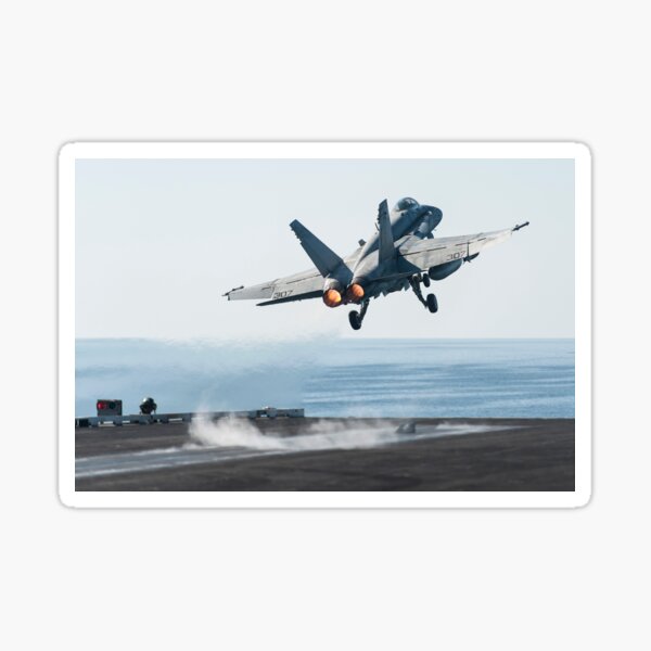 "An F/A-18C Hornet launches from the flight deck of USS Harry S. Truman ...