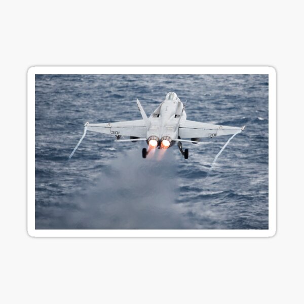 "An F/A-18C Hornet launches from the flight deck of USS Harry S. Truman ...