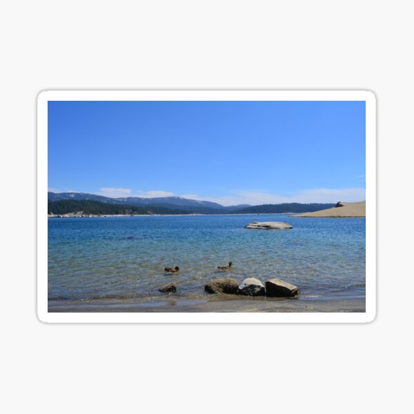 "gorgeous and peaceful blue lake, sky, ducks and far away hills ...