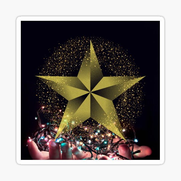"Gold star sparkling gold dust on a black background and handheld ...