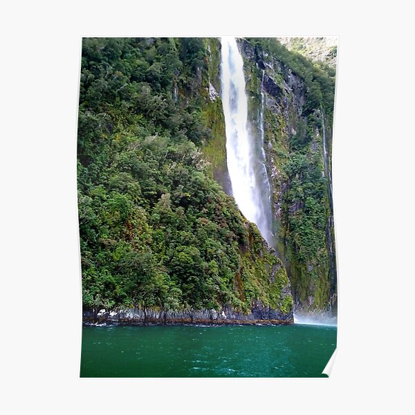 "Loud majestic waterfall crashing down to the ocean below. The white ...