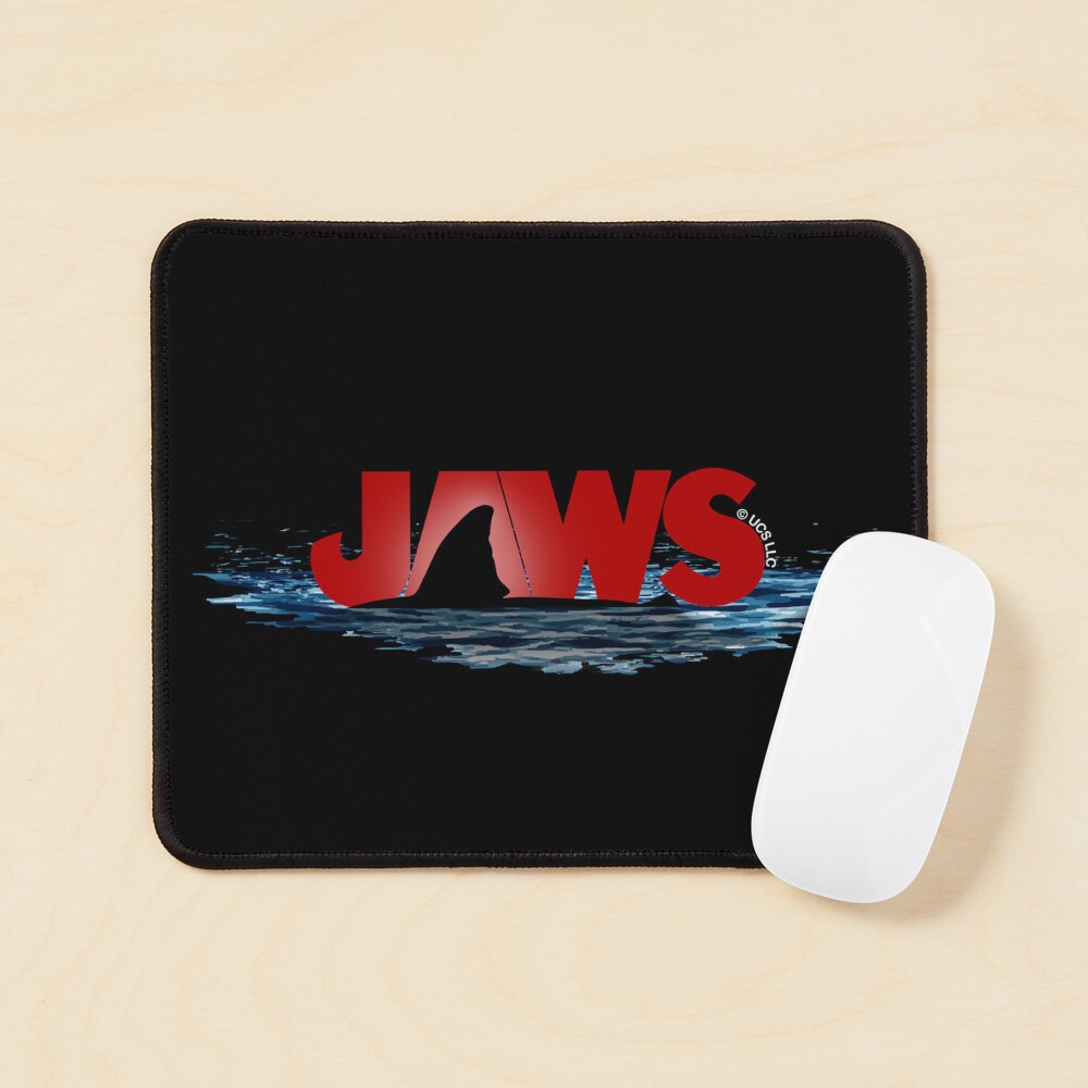 "JAWS LOGO with GREAT WHITE SHARK FIN EMERGING FROM THE OCEAN SURFACE ...