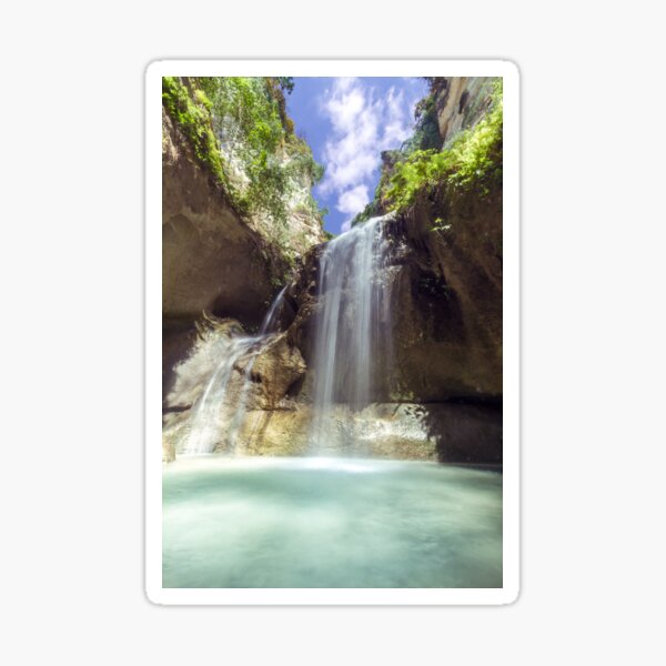 "Cascade of transparent water falling to a spring in nature surrounded ...