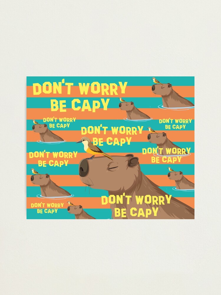 "Cute capybara relaxing in the sun saying dont worry be capy, funny ...