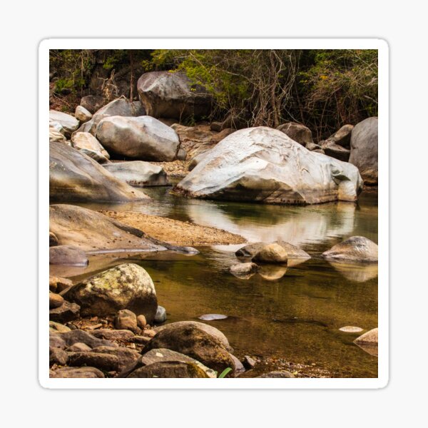"Reflections of rocks and boulders in the Calm River" Sticker for Sale ...