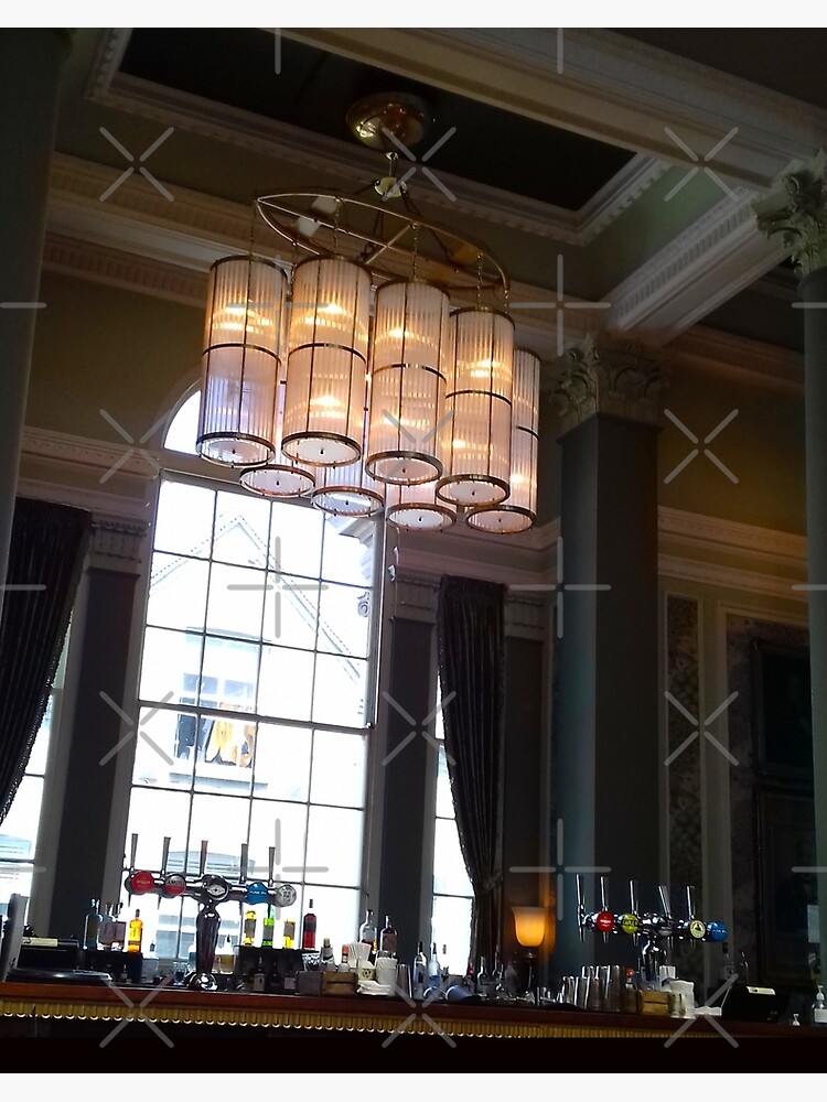 "Hotel bar interior with high ceiling, ornate hanging lights and tall ...