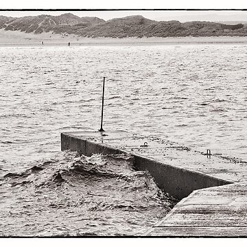 "Wave rolling up the harbour wall at Beadnell, Northumberland, UK ...