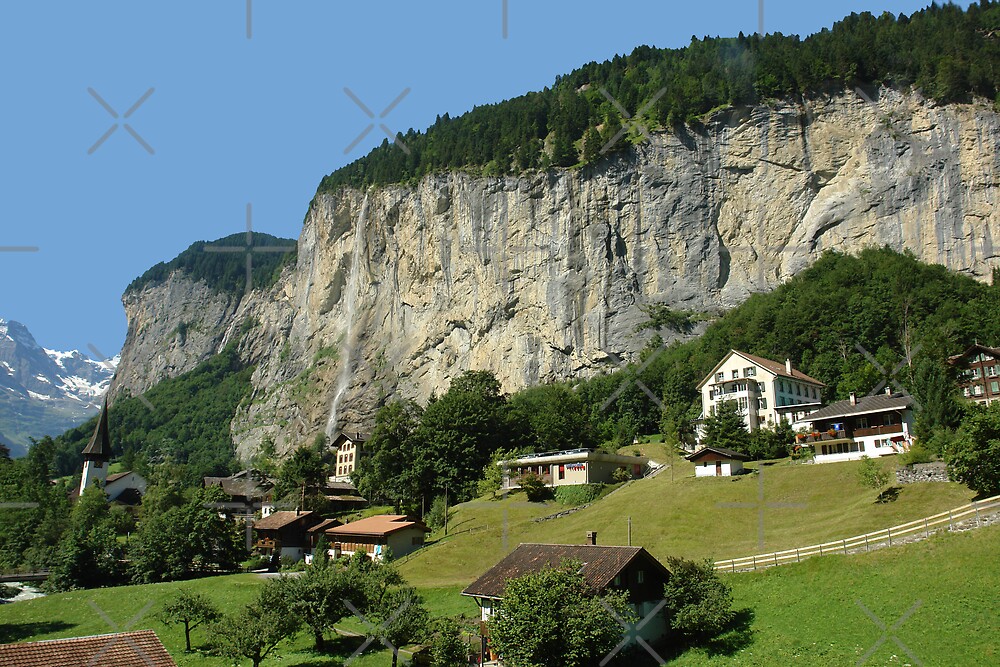 "View of cliffs, houses, slopes, greenery and waterfalls on a Swiss ...