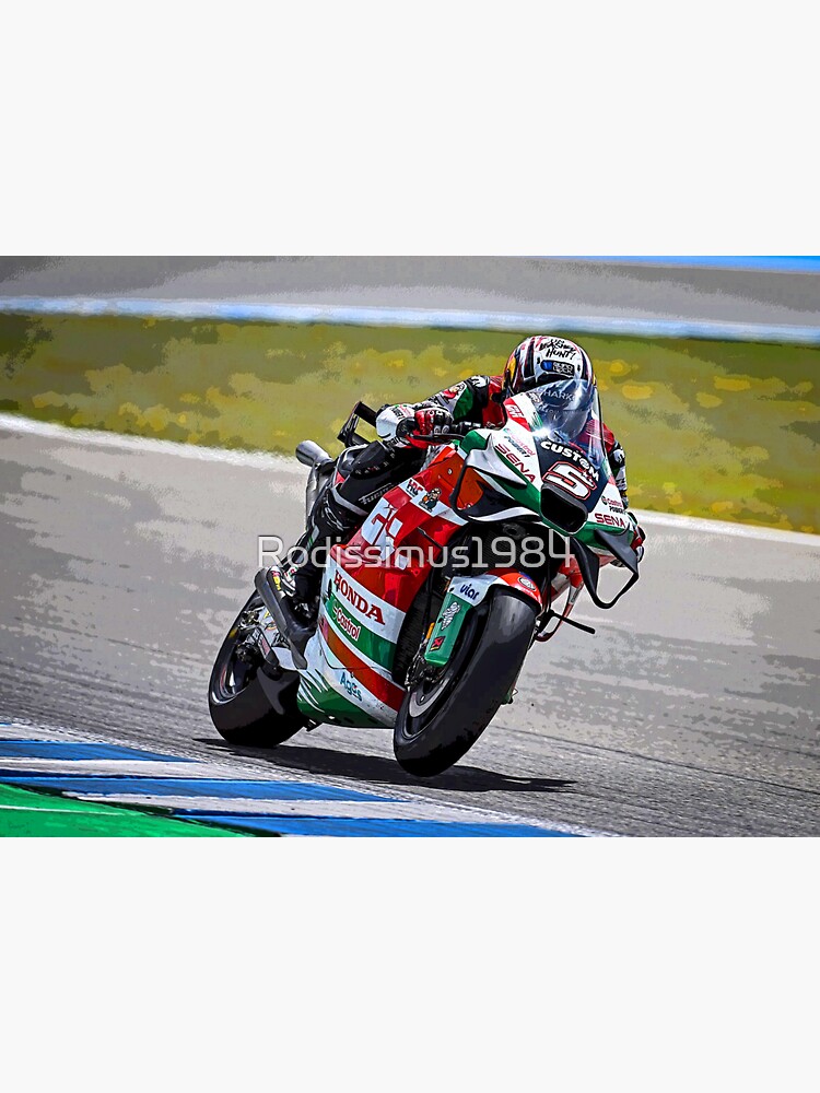 "Johann Zarco on his 2024 MotoGP motorcycle powering out of a corner ...