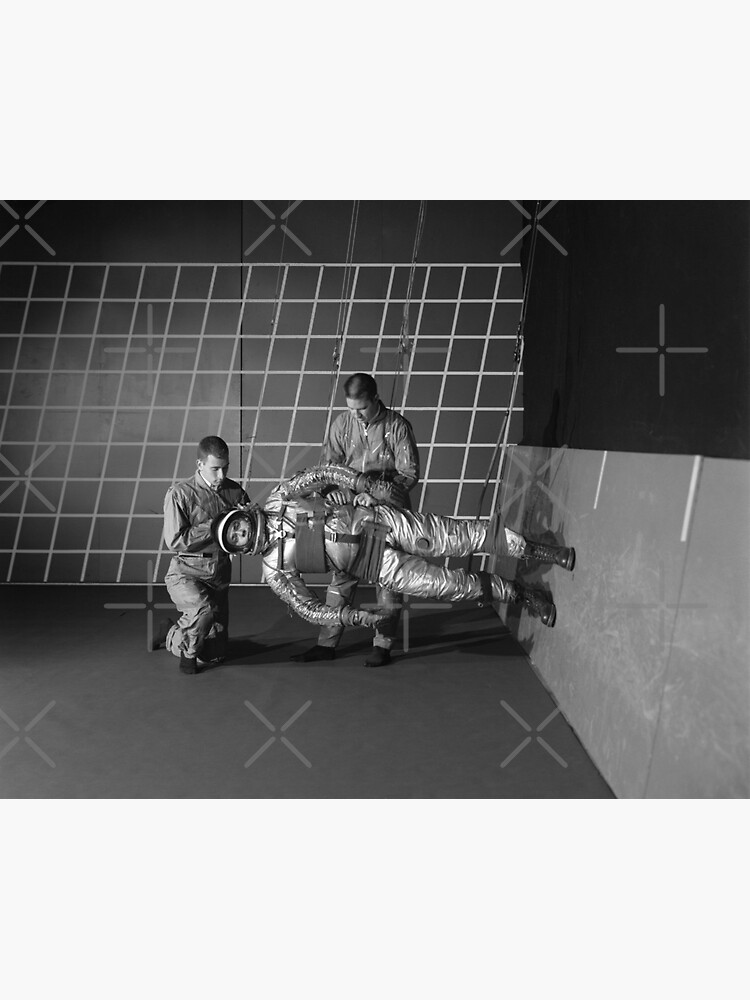 "Defying Gravity in a 1960s NASA Spacesuit Lunar Simulation" Sticker ...