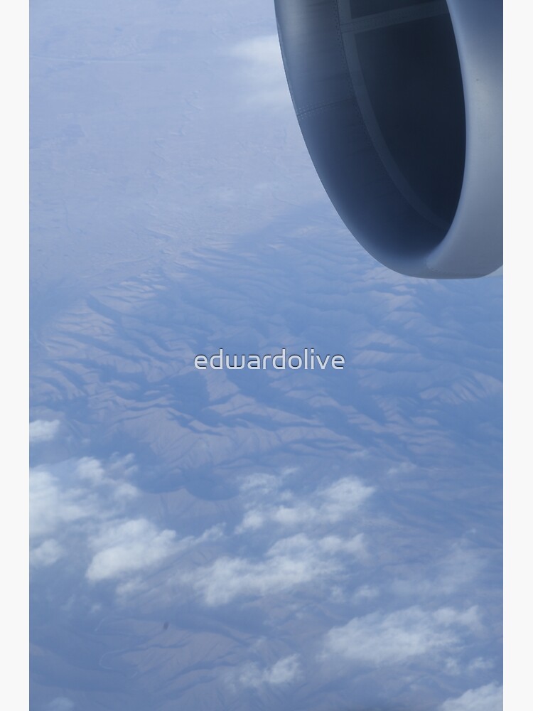 "Jumbo jet airplane wing engine in flight flying over mountains and ...