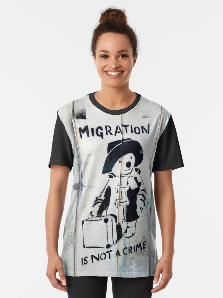 "Migration Is Not A Crime" Graphic T-Shirt for Sale by Sue Porter ...