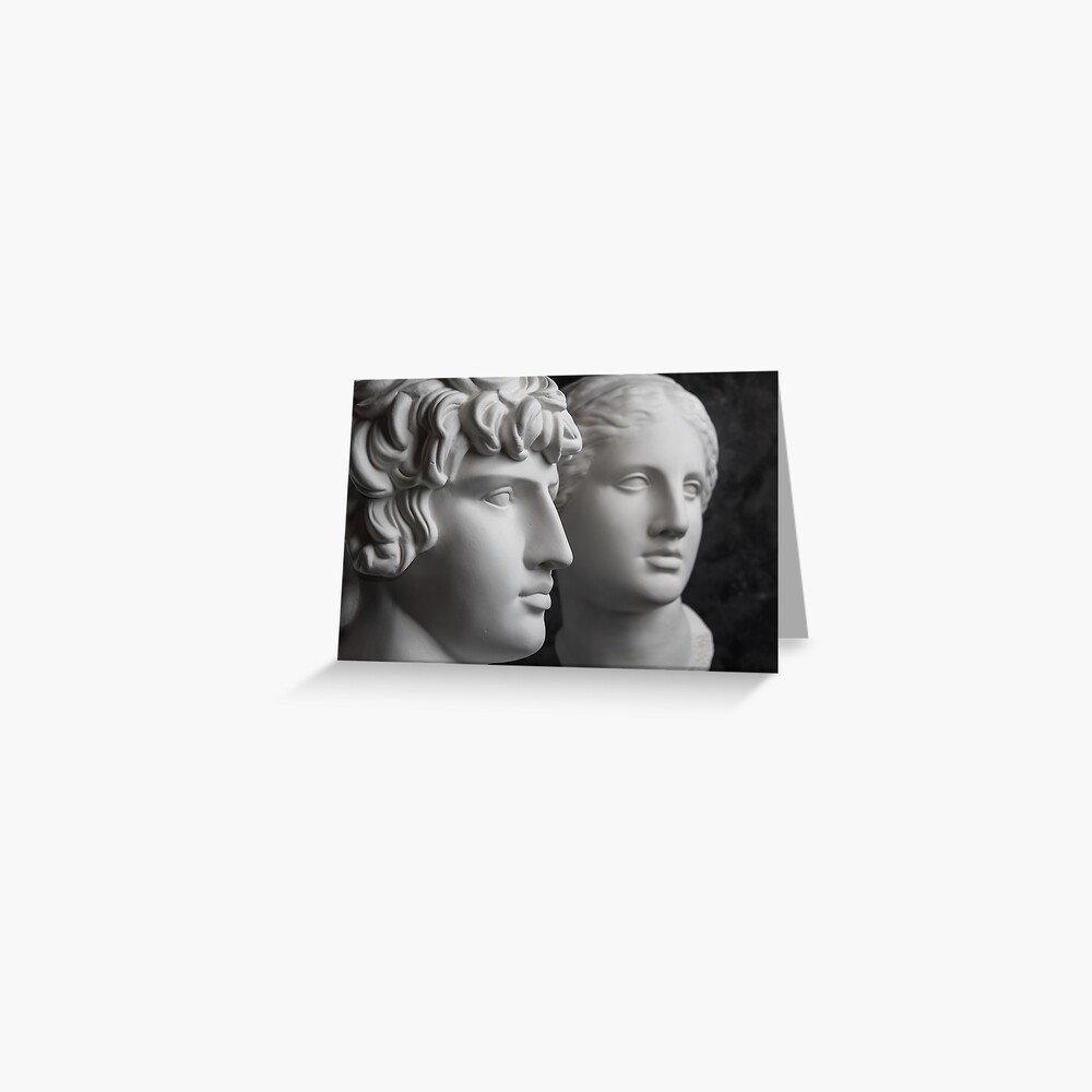 "Gypsum copy of ancient statue Antinous and Venus head on dark textured ...